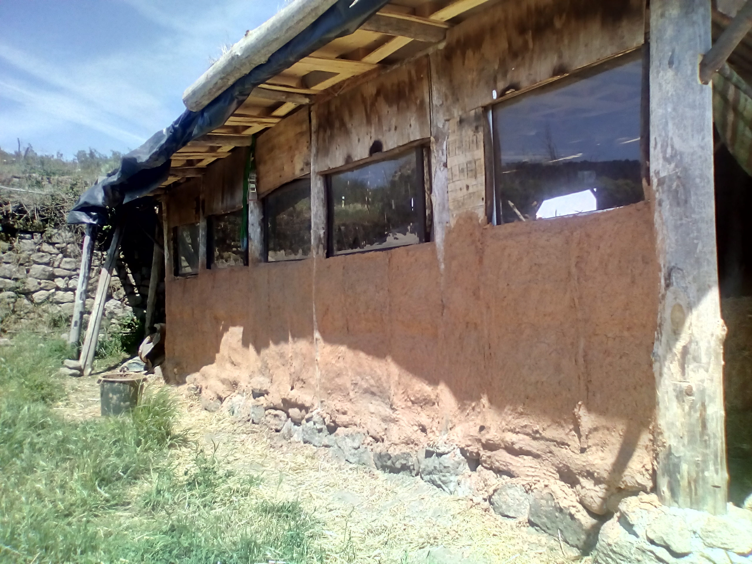 Eco Program in Portugal: Clay plastering the common house at a new...